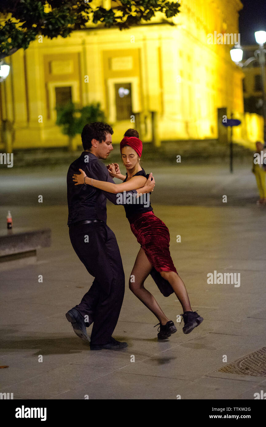 A couple dance in the streets of Sevilla Stock Photo - Alamy