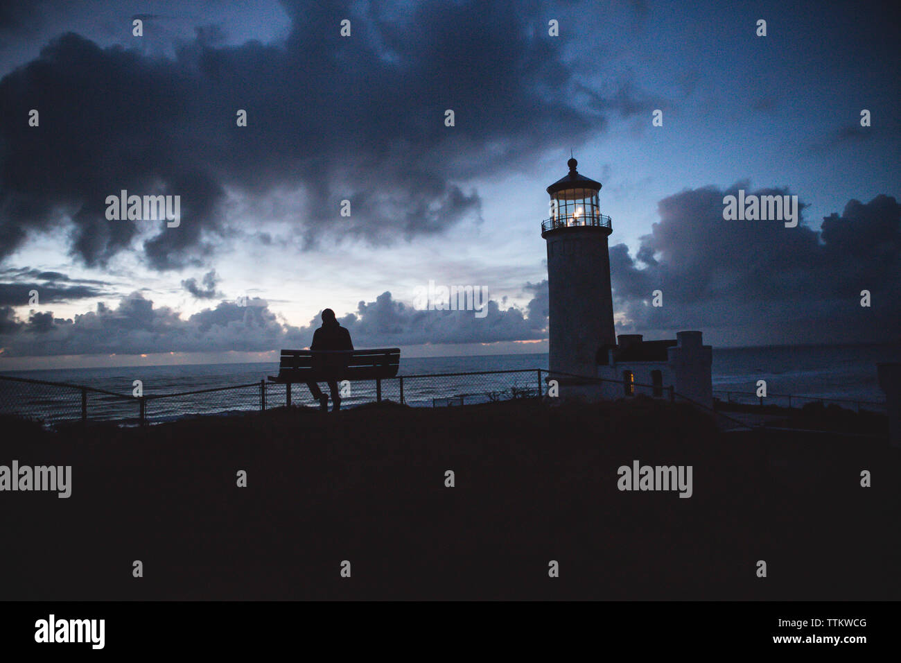 Man Sitting On Bench At Sunset High Resolution Stock Photography and ...