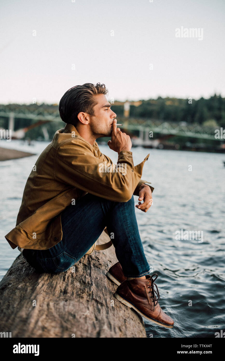 Man sitting smoking hi-res stock photography and images - Alamy