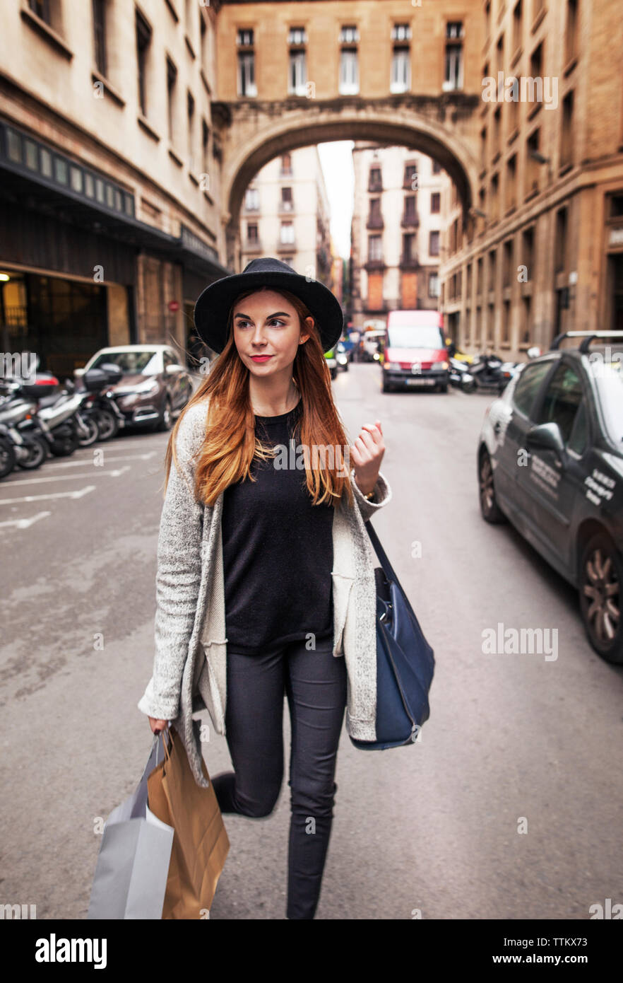 Carrying shopping bags hi-res stock photography and images - Alamy