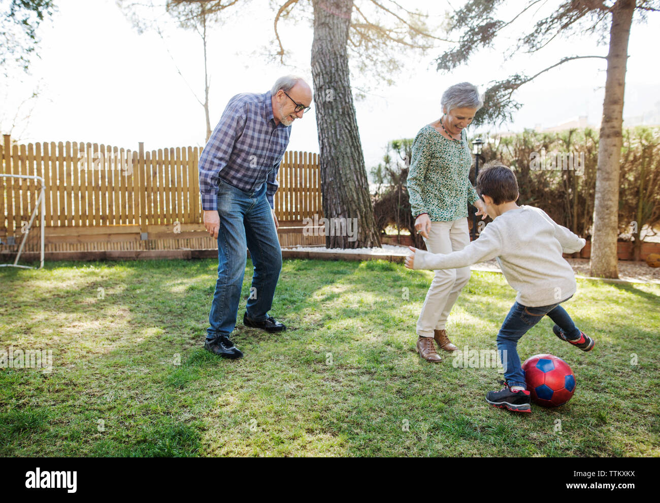 Grandparents and grandchildren playing hi-res stock photography and ...