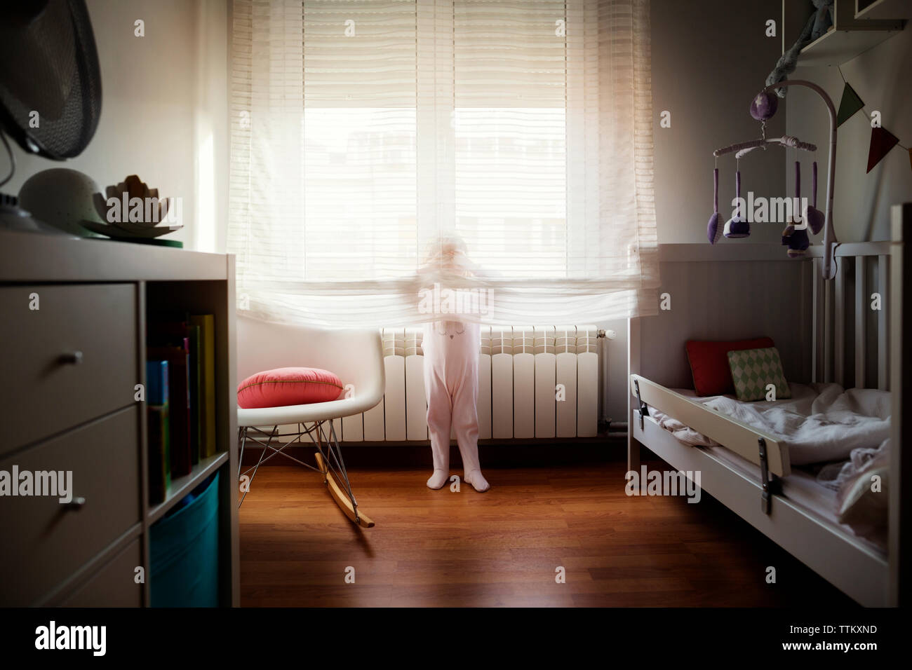 Girl Hiding Behind Chair Stock Photos & Girl Hiding Behind Chair Stock ...