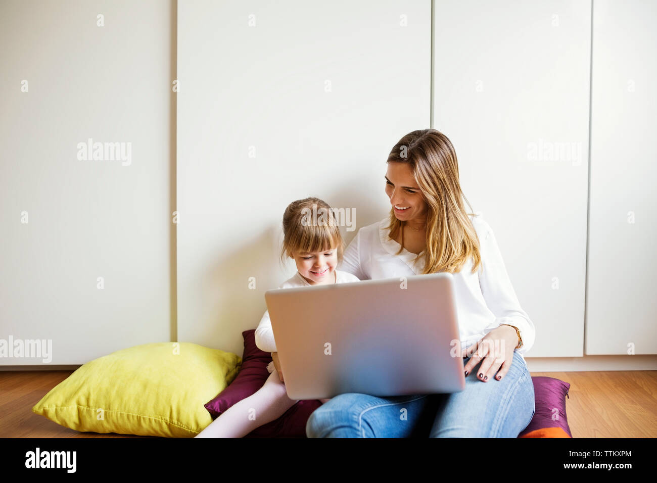Caucasian mother and daughter using laptop hi-res stock photography and ...