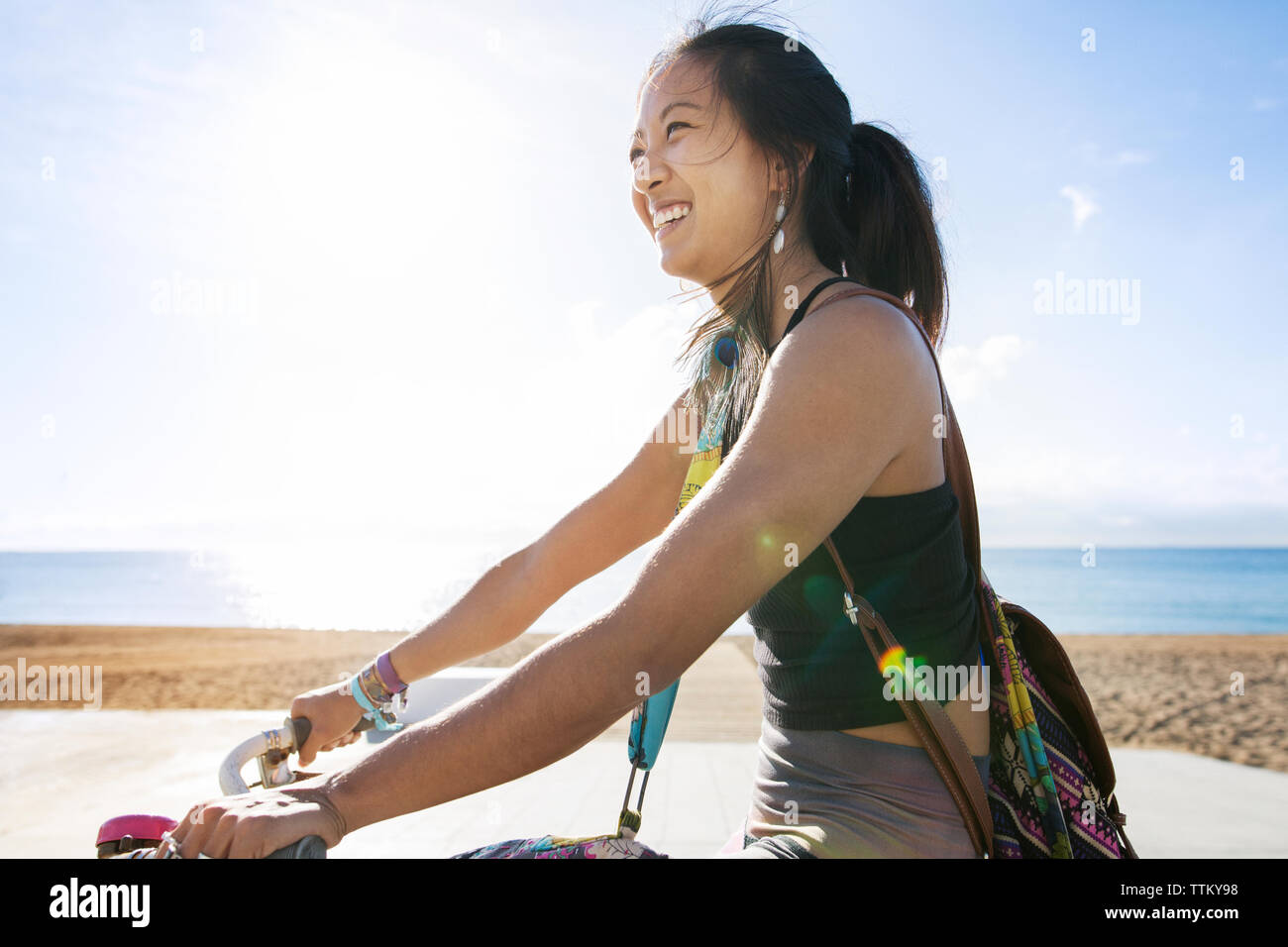Riding bicycle beach hi-res stock photography and images - Alamy