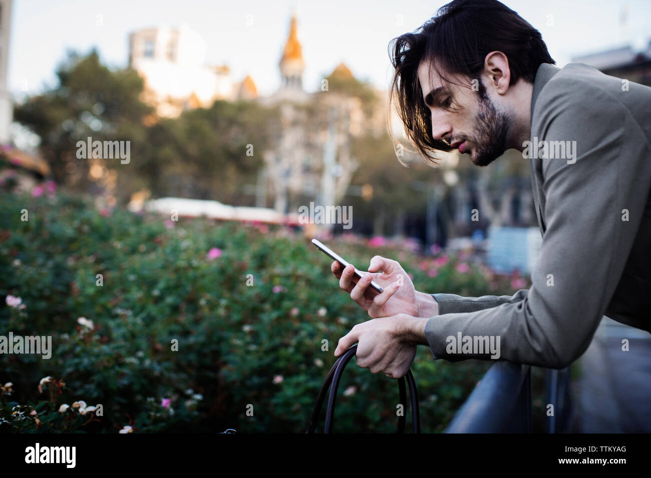 Leaning railing park hi-res stock photography and images - Alamy