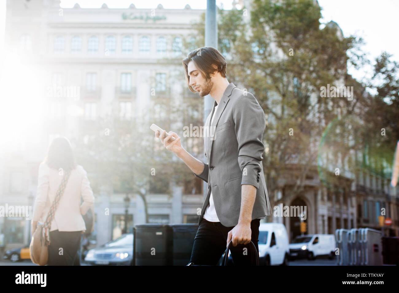 Man walking side view phone hi-res stock photography and images - Alamy