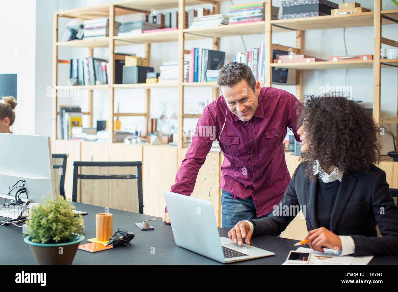 Discussing documents two people data hi-res stock photography and ...