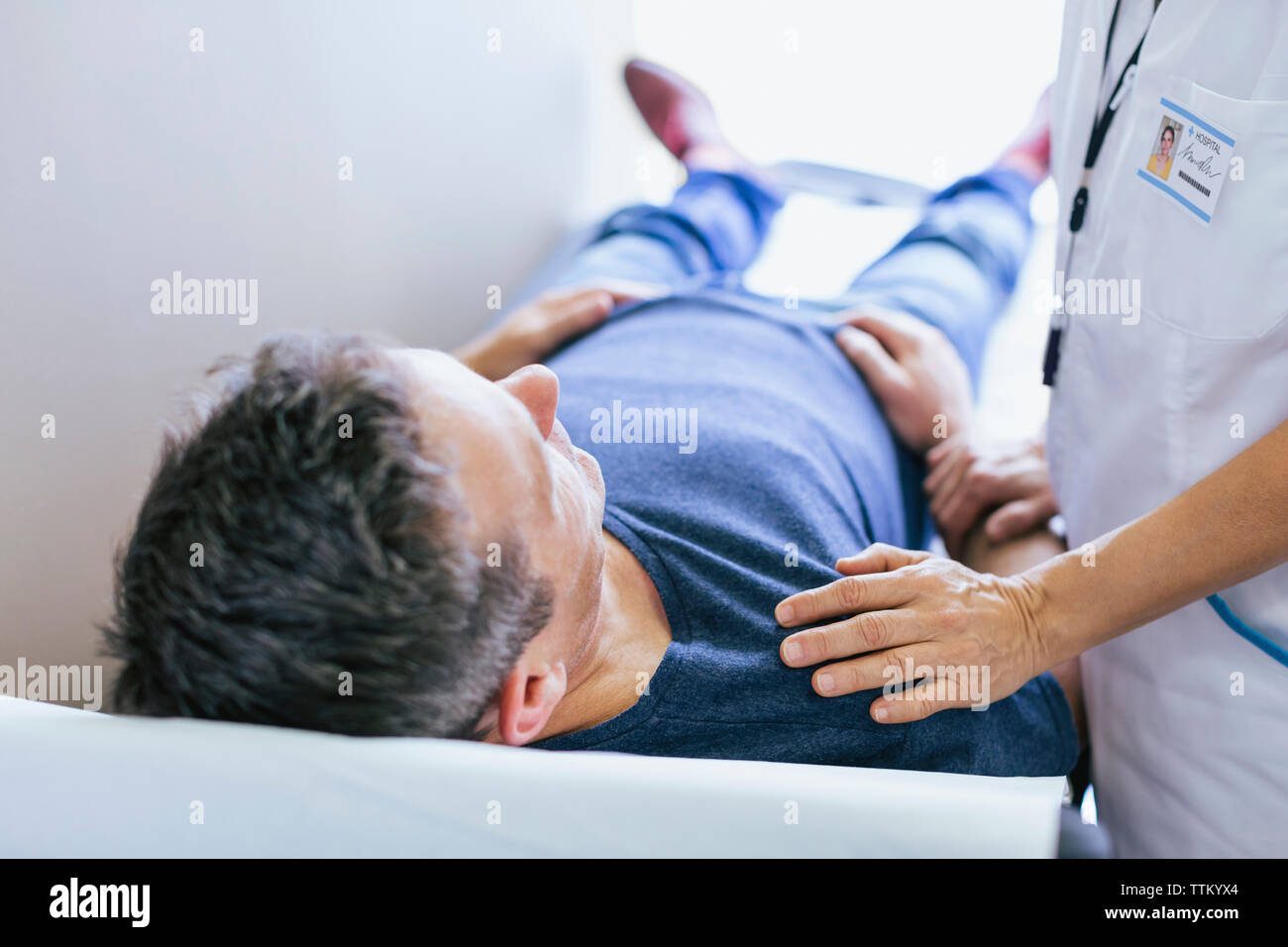 Back view patient man hospital bed hi-res stock photography and images ...