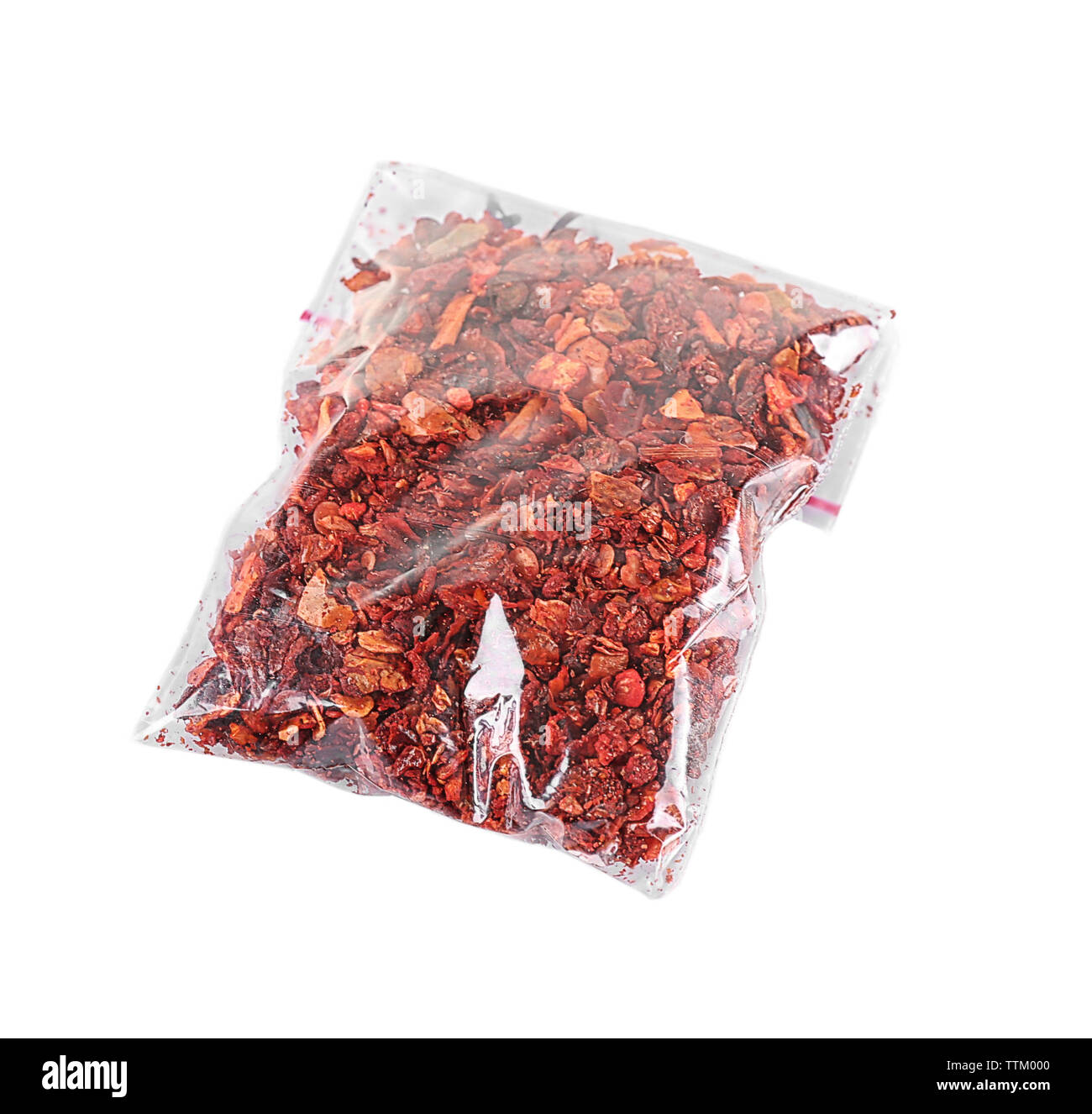 Dried chopped chili pepper in plastic zipper bag, isolated on white ...