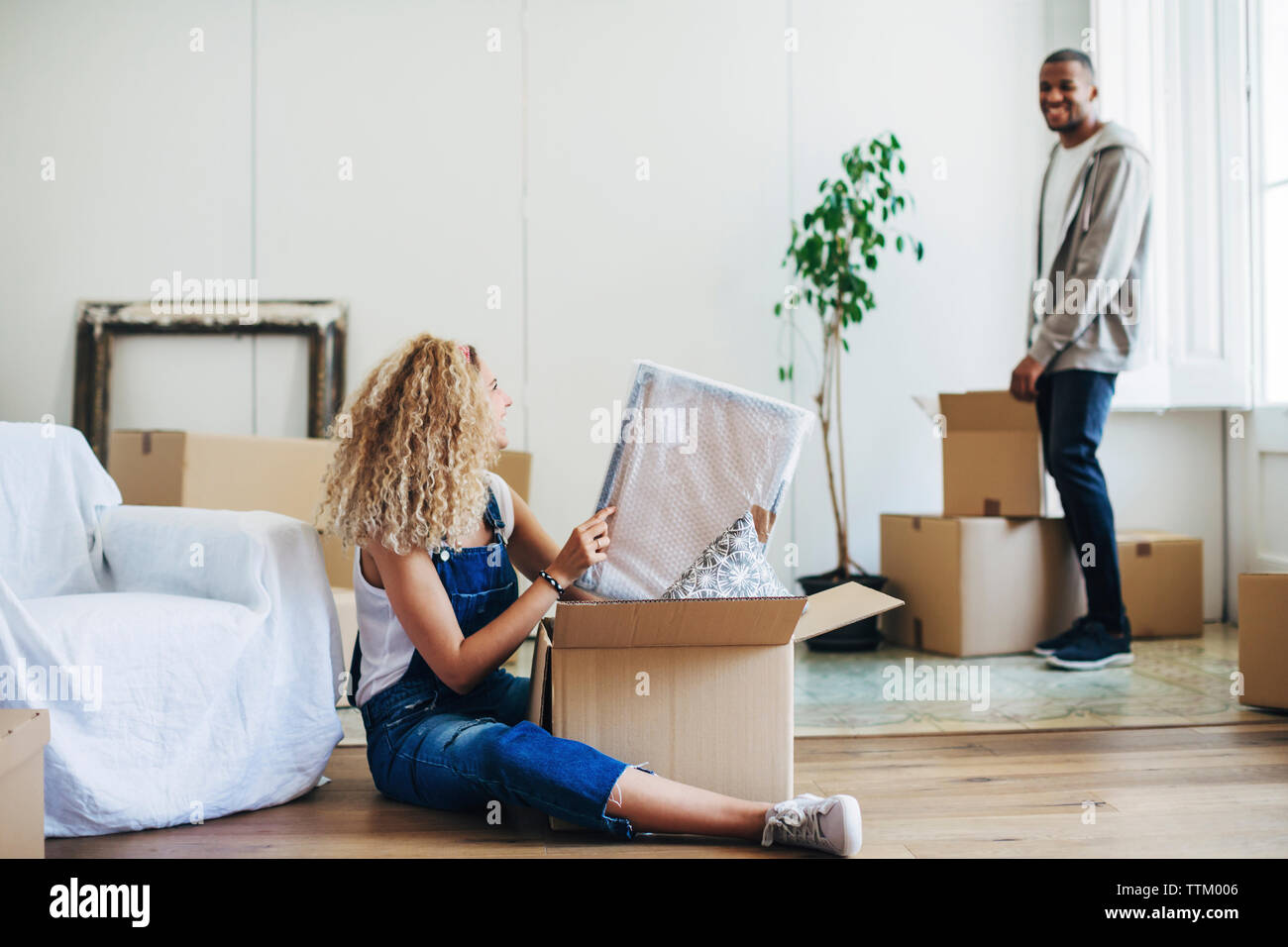 Front view caucasian couple unpacking hi-res stock photography and ...