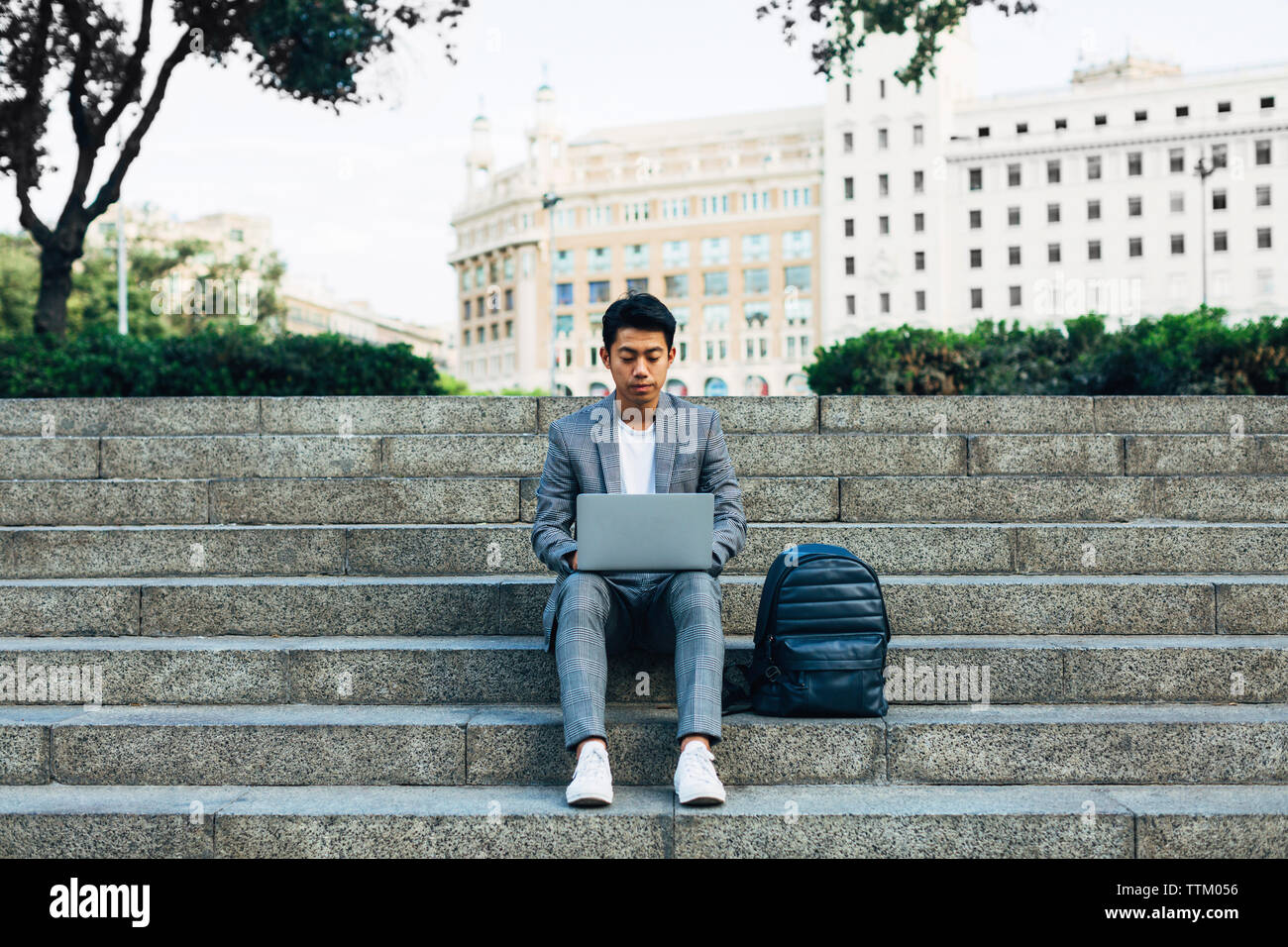Indian man sitting on steps hi-res stock photography and images - Alamy