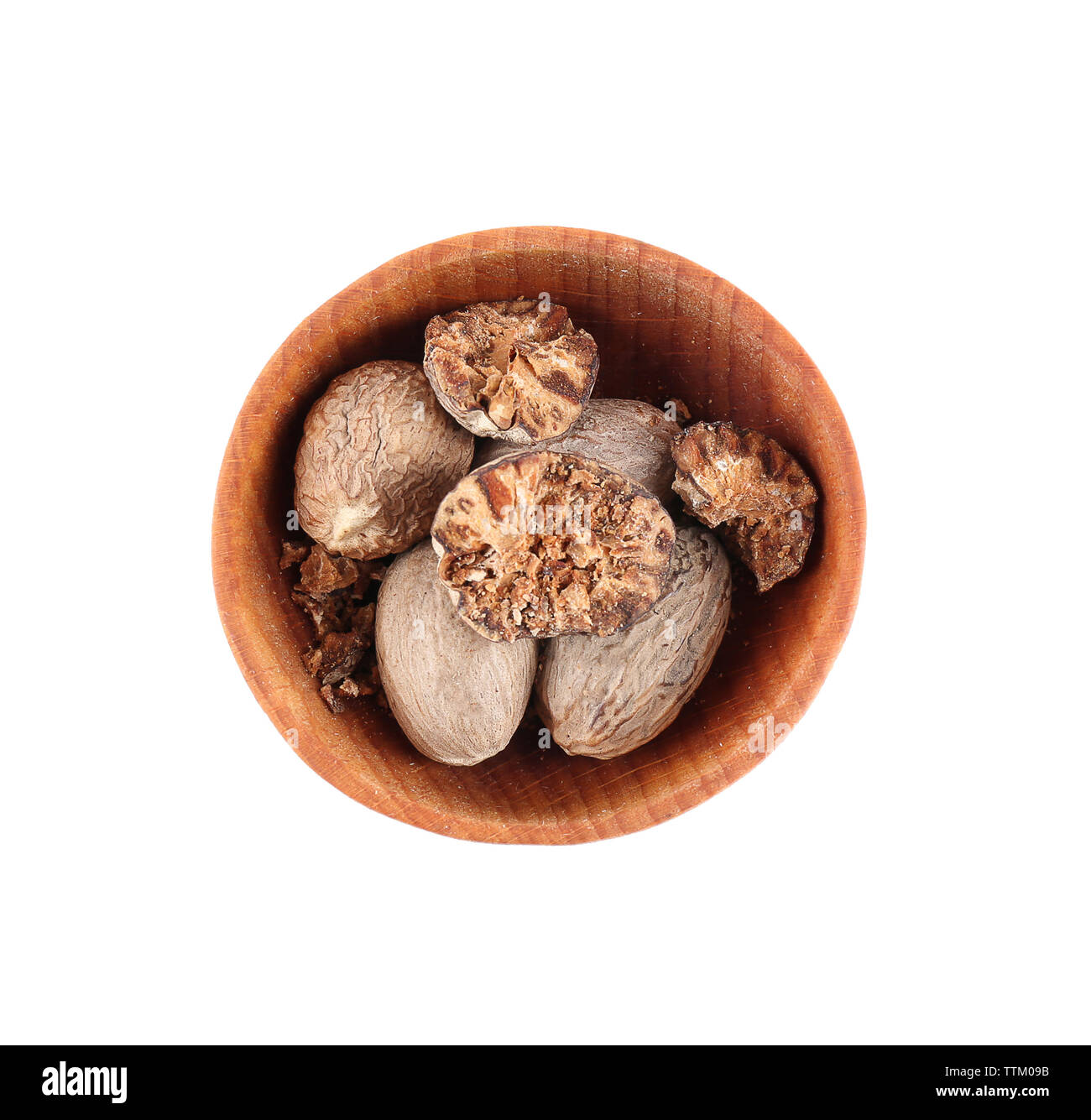Crushed nutmeg in small wooden bowl isolated on white Stock Photo - Alamy
