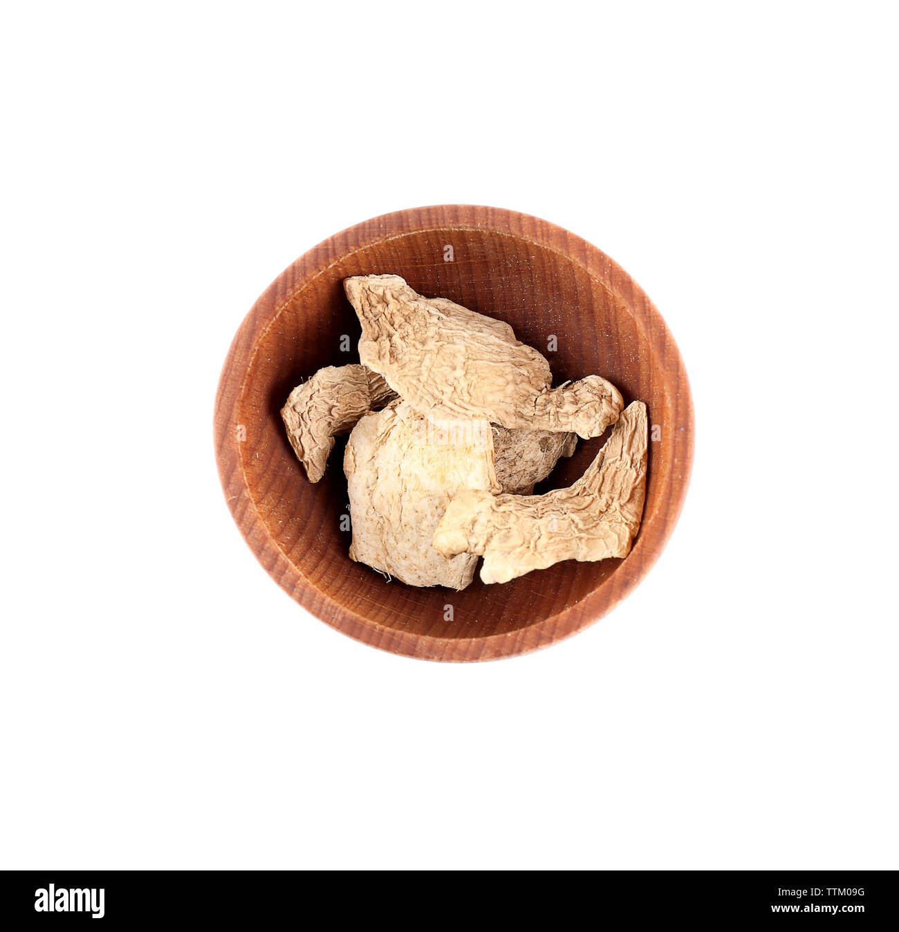 Dried ginger slices in small wooden bowl isolated on white Stock Photo ...