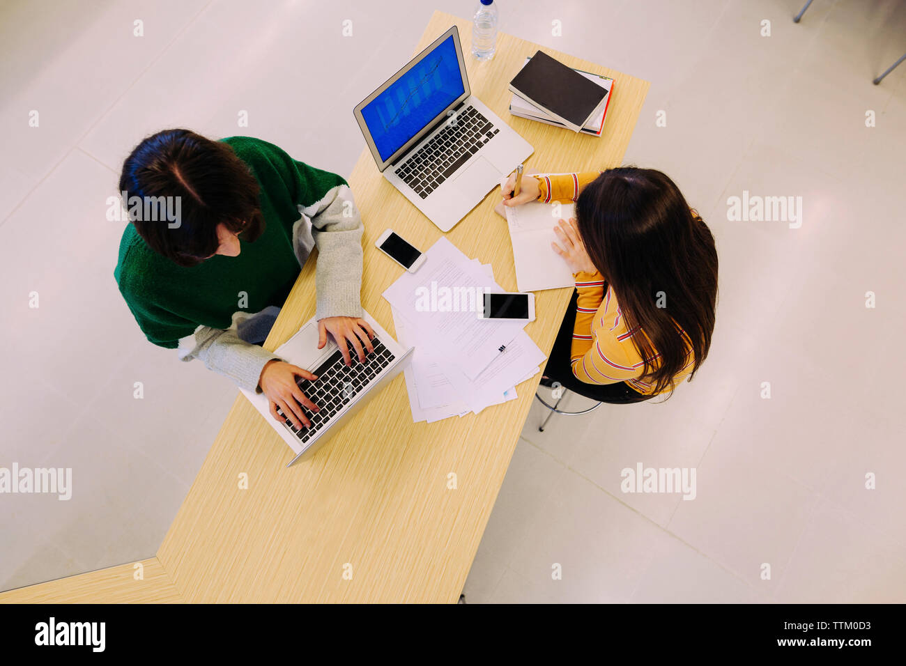 Two adults studying in library hi-res stock photography and images - Alamy