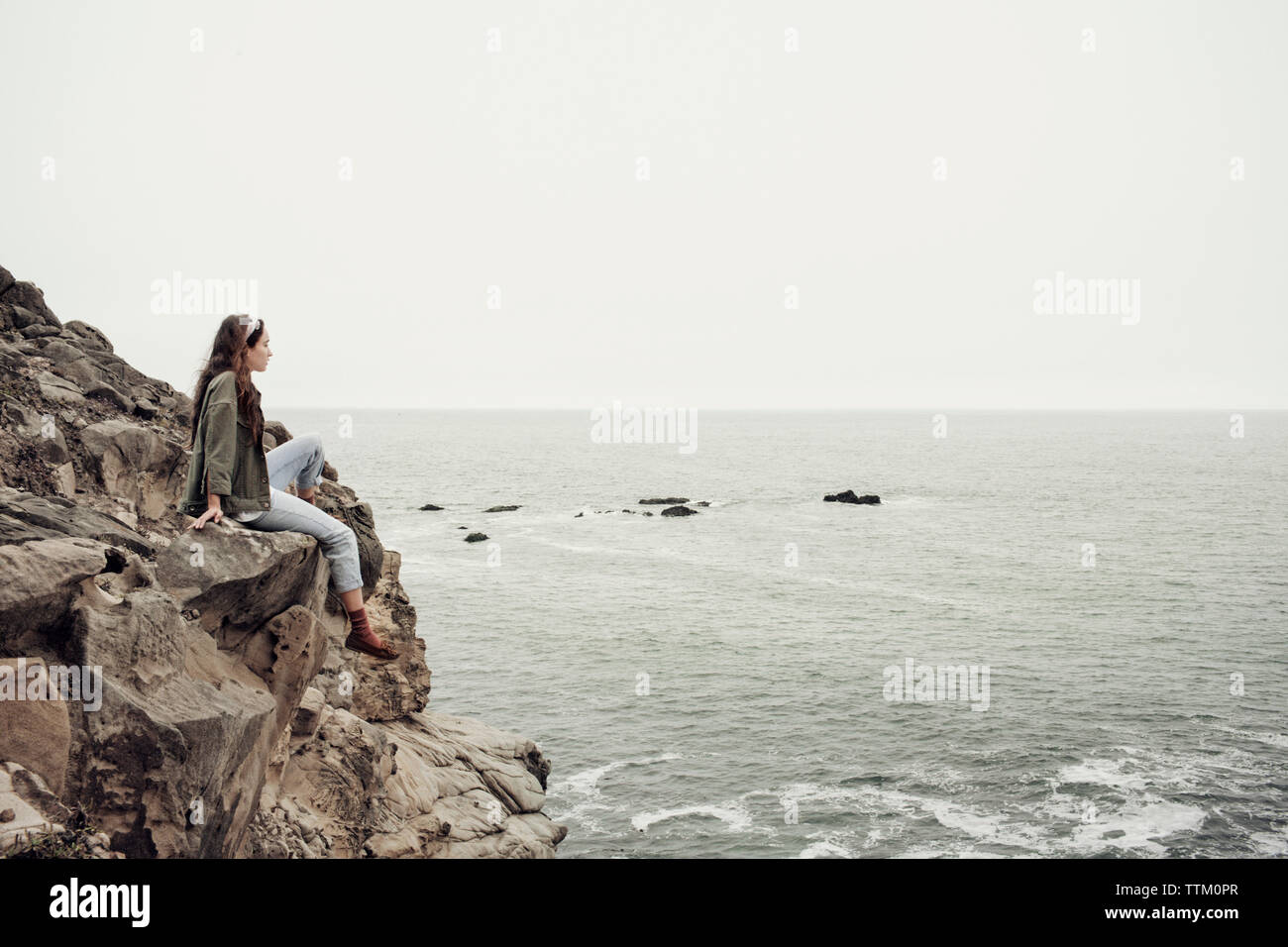 Woman cliff water hi-res stock photography and images - Alamy