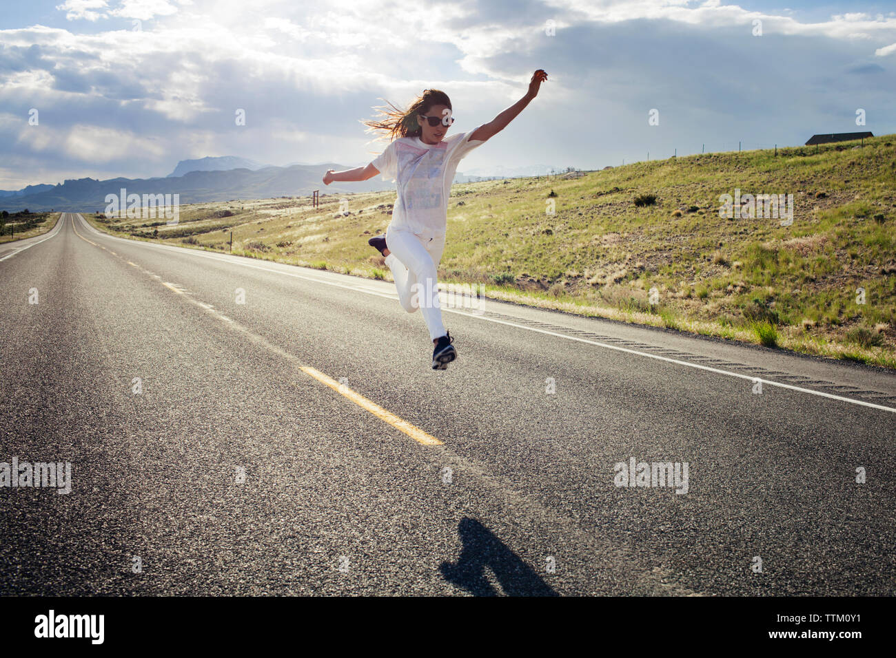 Happy jumping woman field hi-res stock photography and images - Alamy
