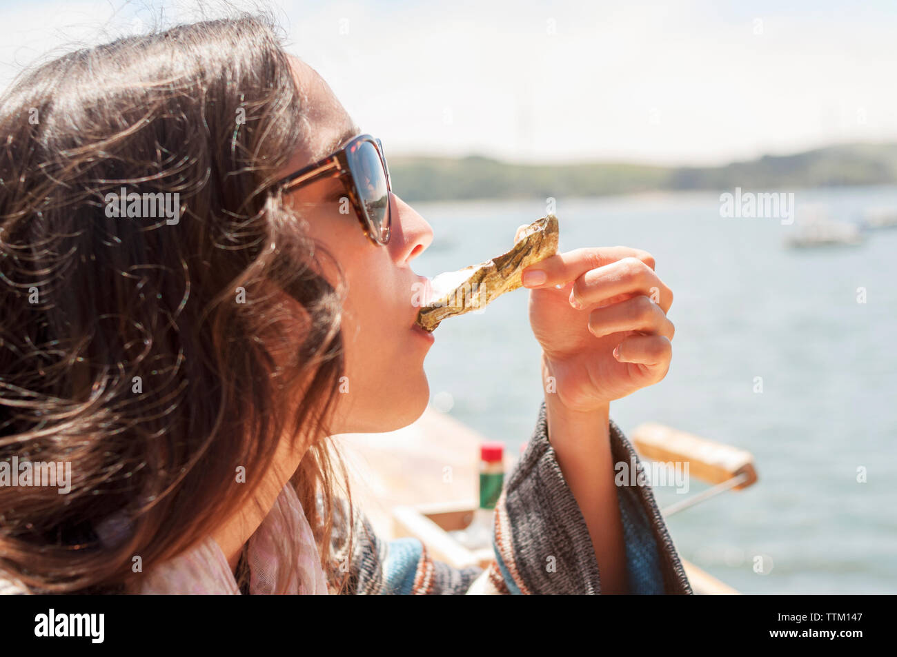 Close up woman eating oyster hi-res stock photography and images - Alamy