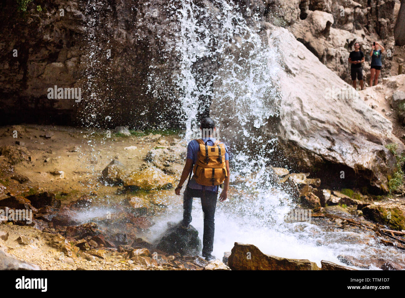Man under waterfall hi-res stock photography and images - Alamy