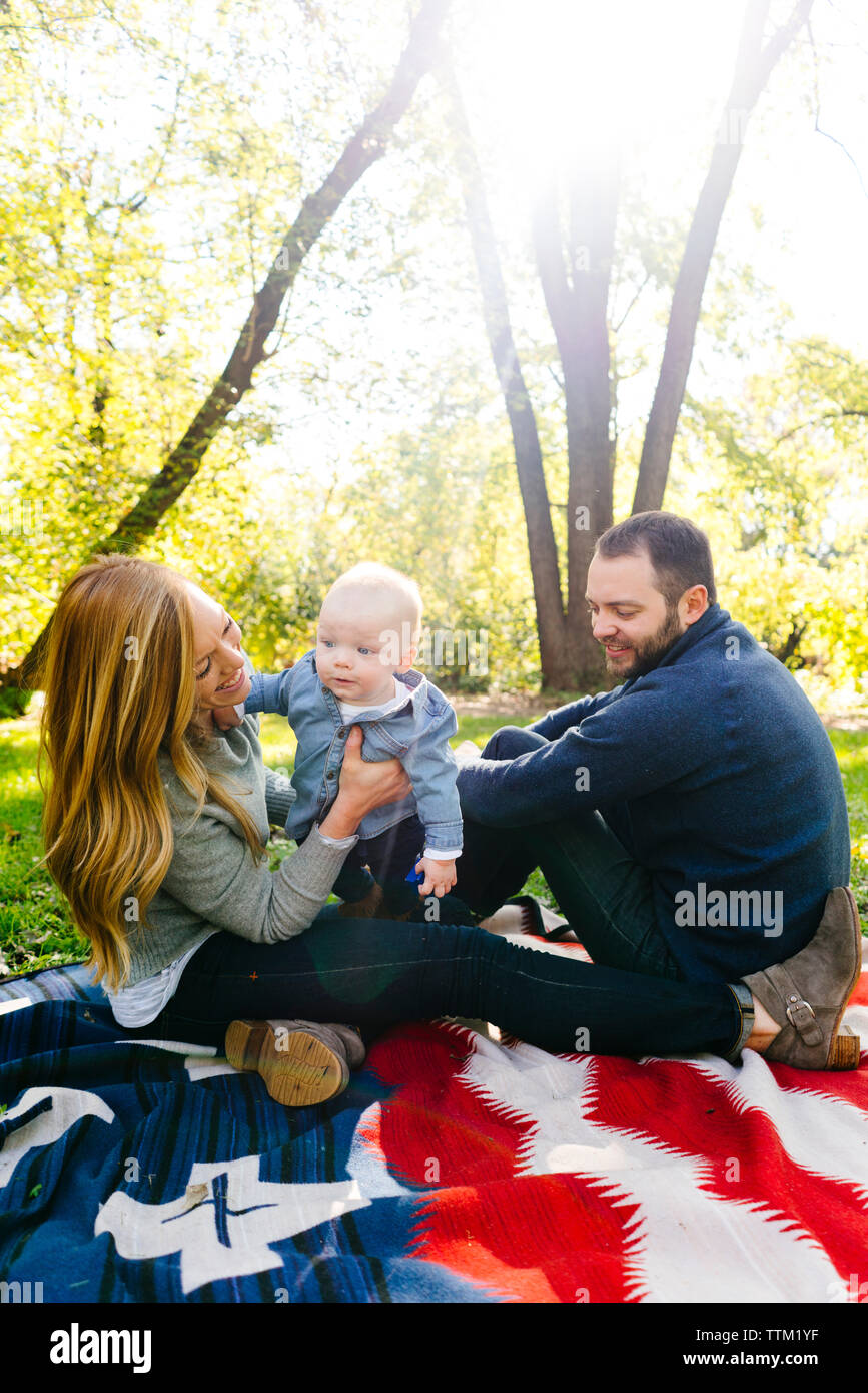 Happy family with baby outside hi-res stock photography and images - Alamy