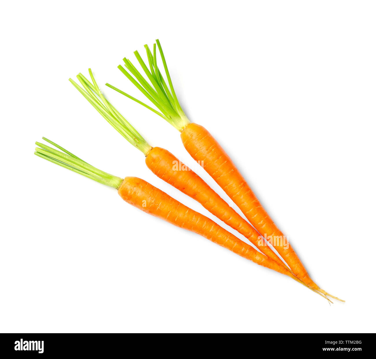 Carrots isolated on white Stock Photo - Alamy