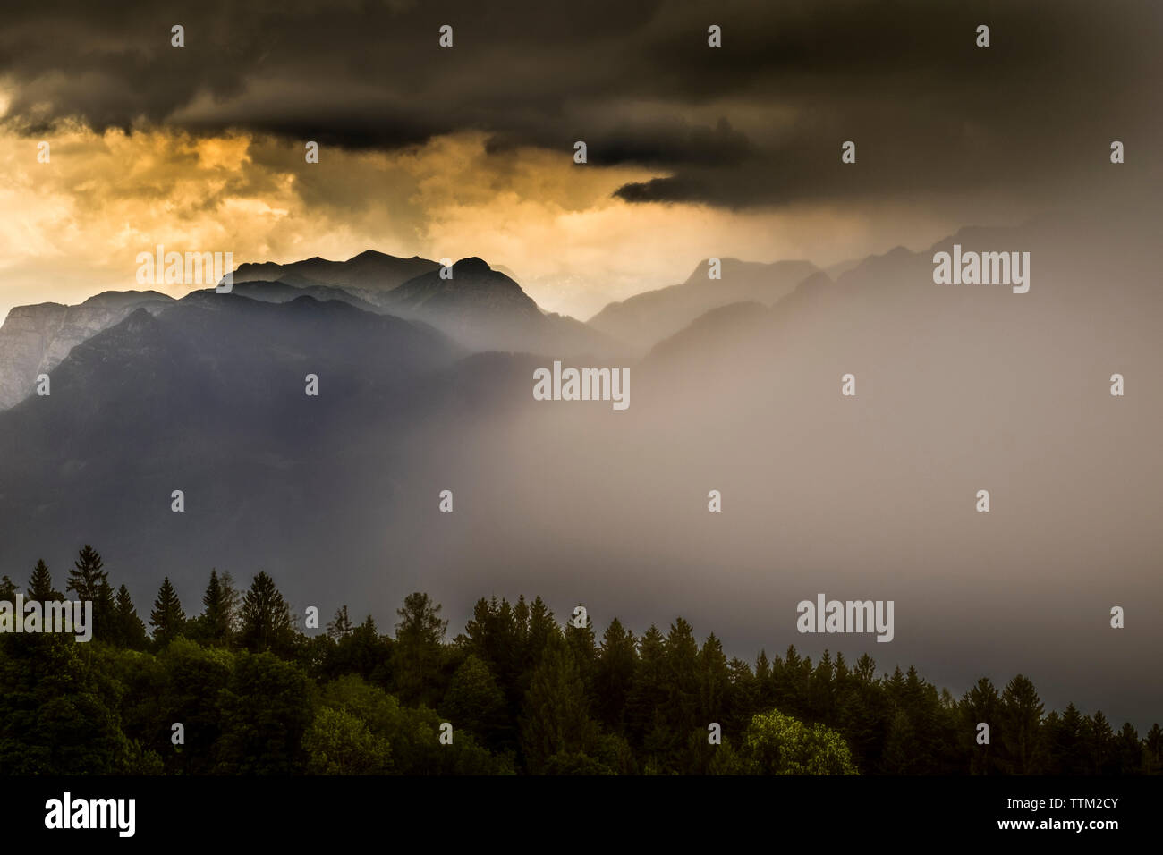 Storm clouds over mountains hi-res stock photography and images - Alamy