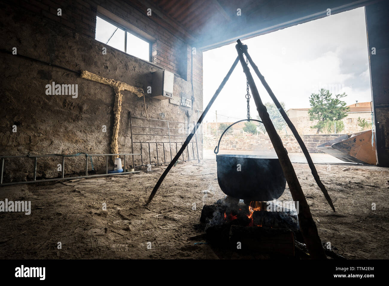 Stew cooking in utensil at barn Stock Photo - Alamy