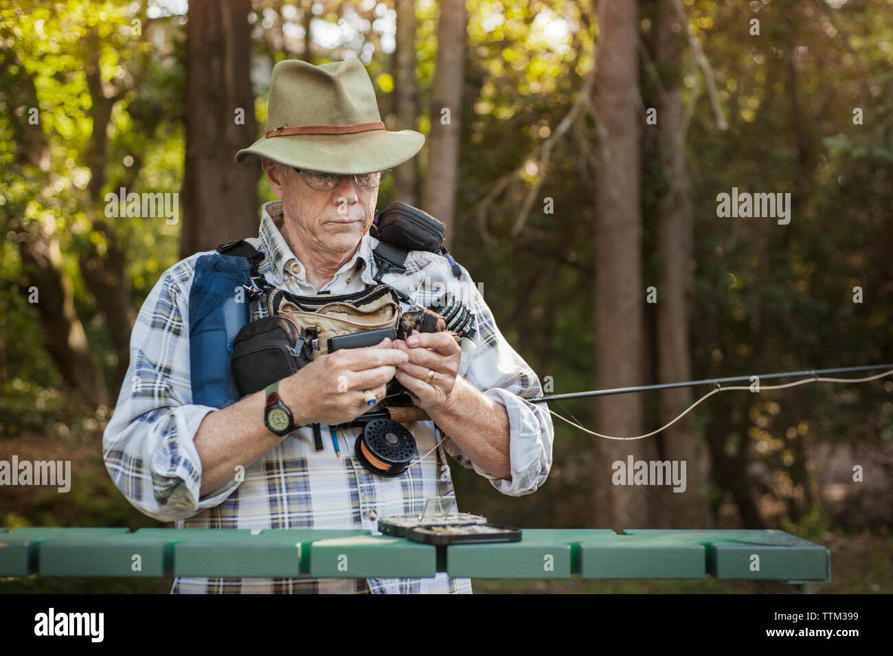 Man with fishing rod hi-res stock photography and images - Alamy