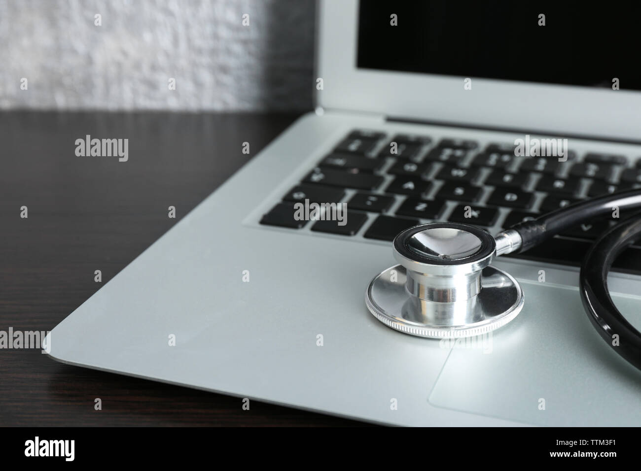 Laptop with stethoscope, closeup Stock Photo - Alamy