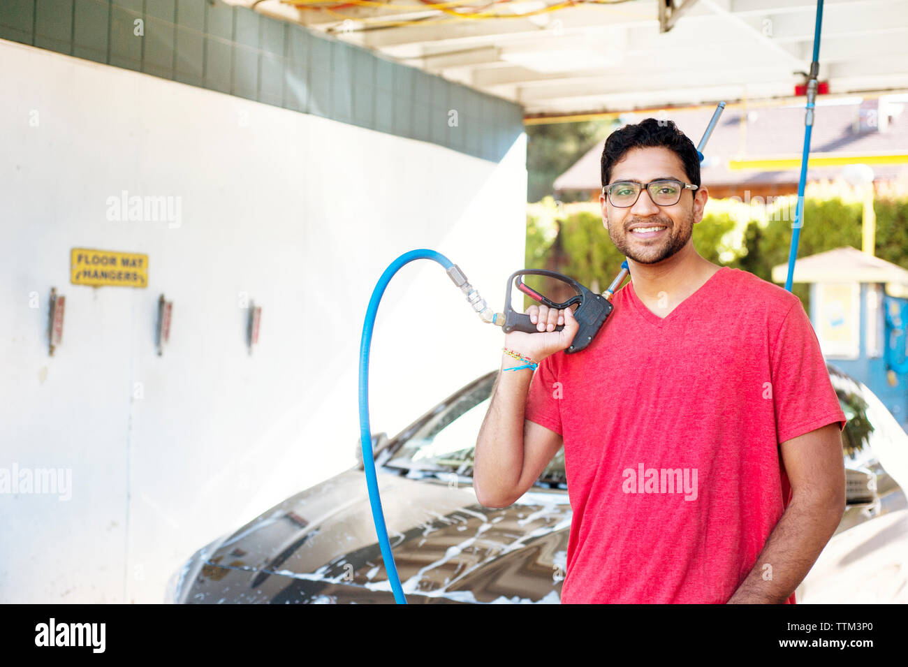 Man holding hose hi-res stock photography and images - Alamy