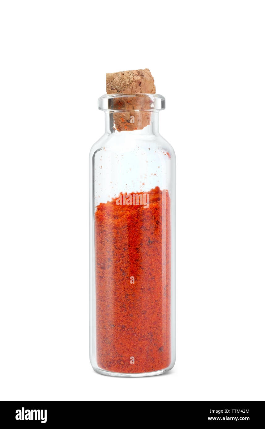 Powdered paprika in glass bottle on white background Stock Photo - Alamy