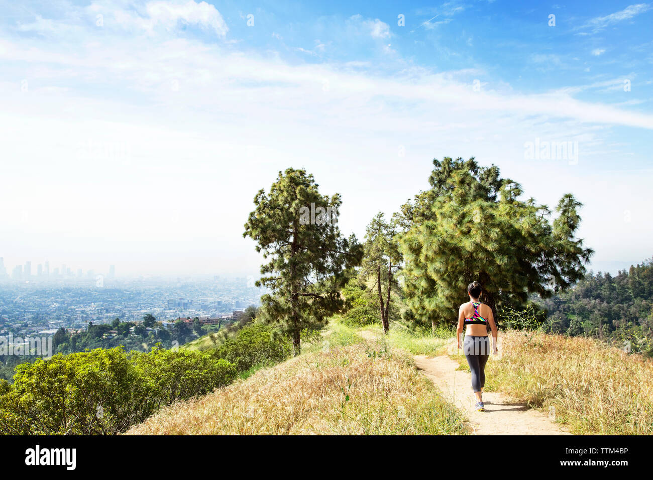 Asian woman walking rear view hi-res stock photography and images - Alamy