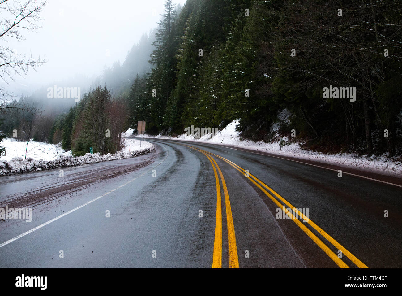Highway through winter forest hi-res stock photography and images - Alamy
