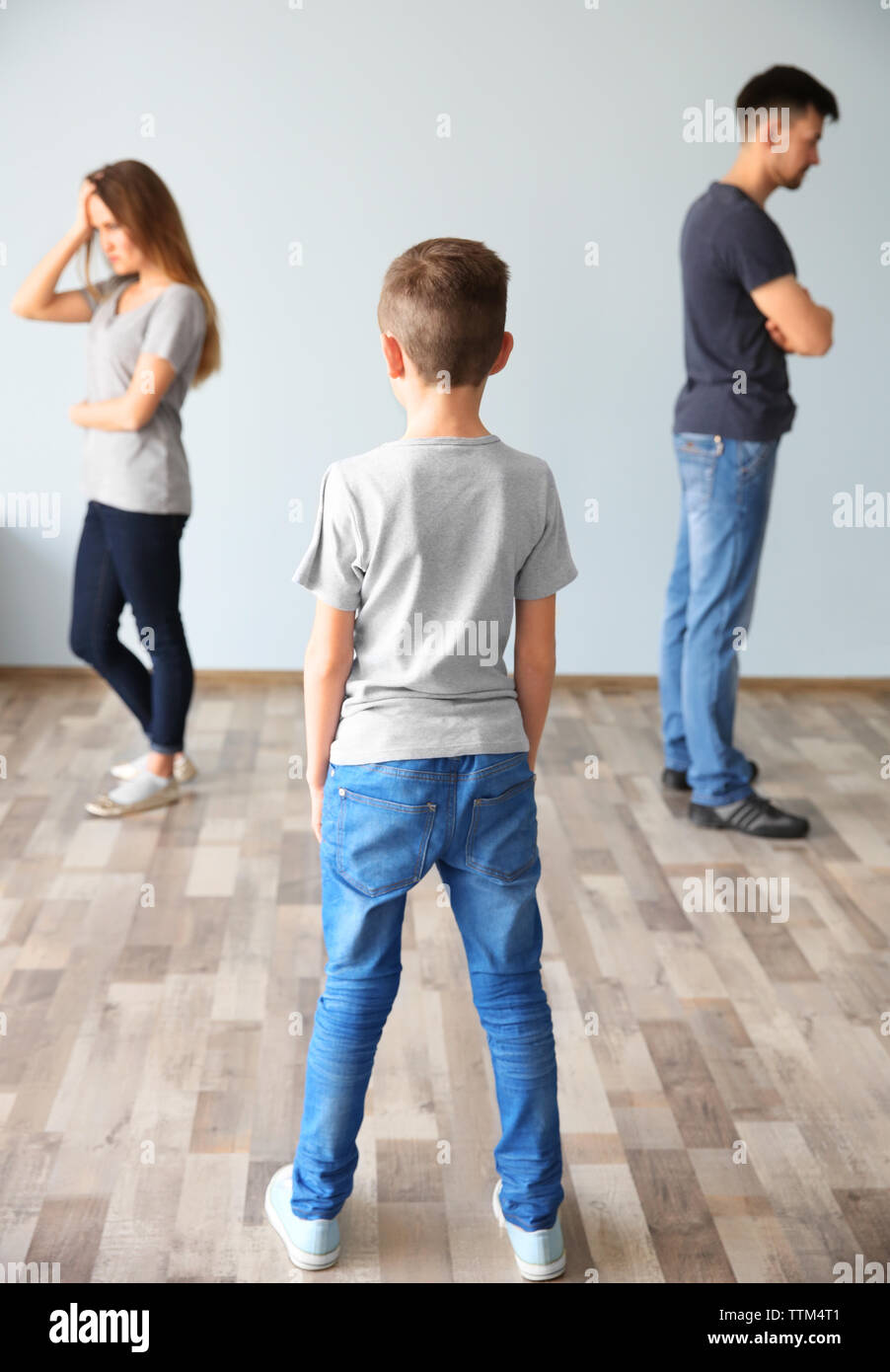 Family problems concept. Boy looking on abusing parents Stock Photo - Alamy