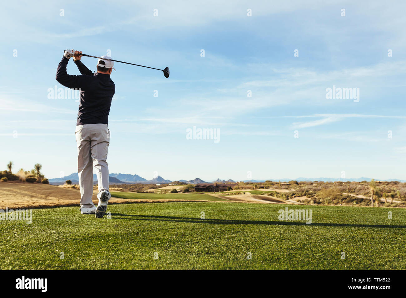 Rear view of golfer hi-res stock photography and images - Alamy