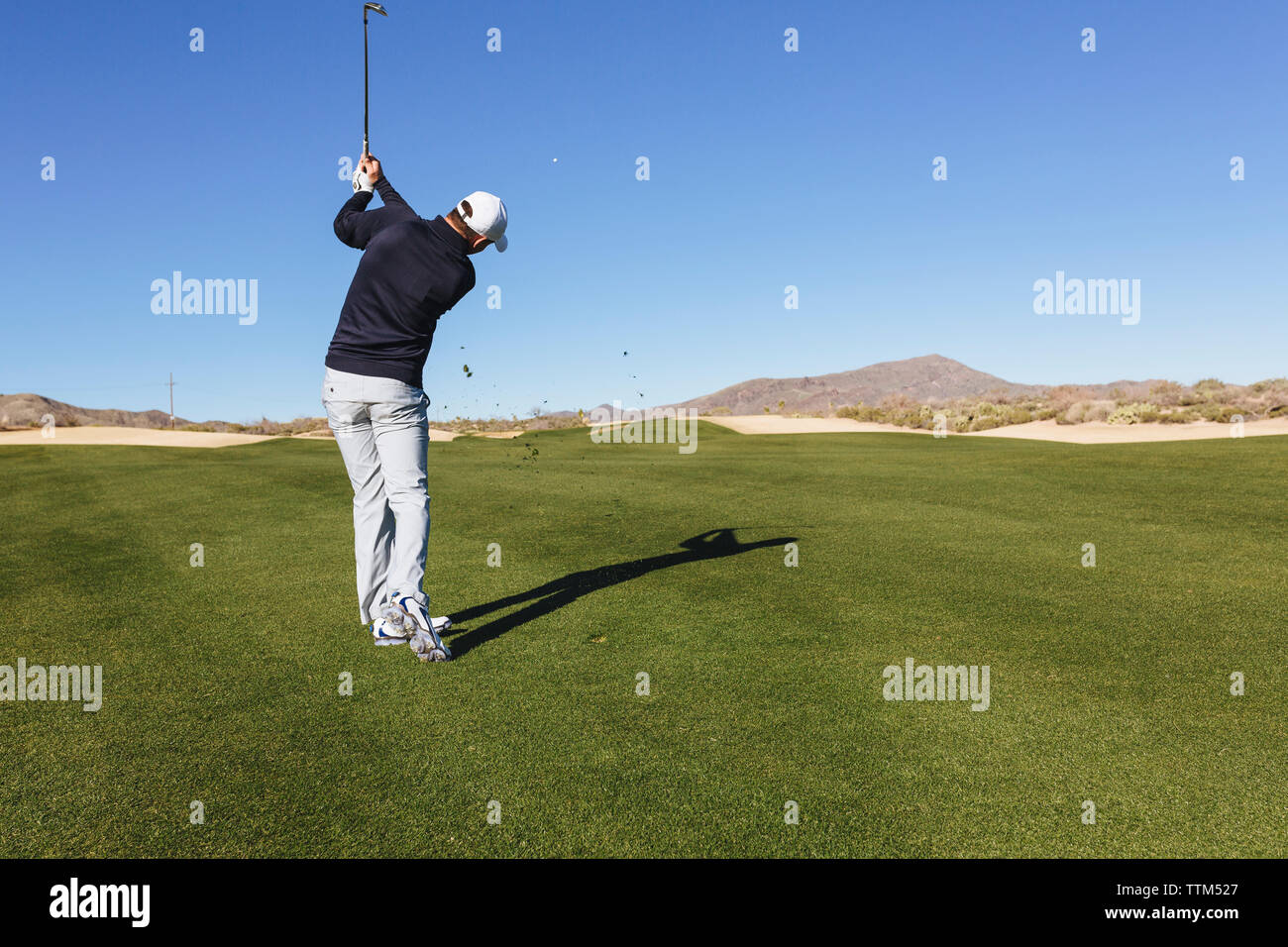 Golfer swinging on golf course hi-res stock photography and images - Alamy
