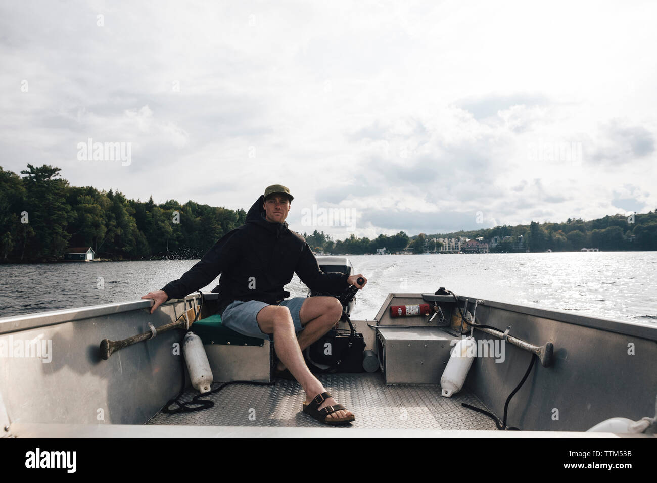Man on motorboat hi-res stock photography and images - Alamy