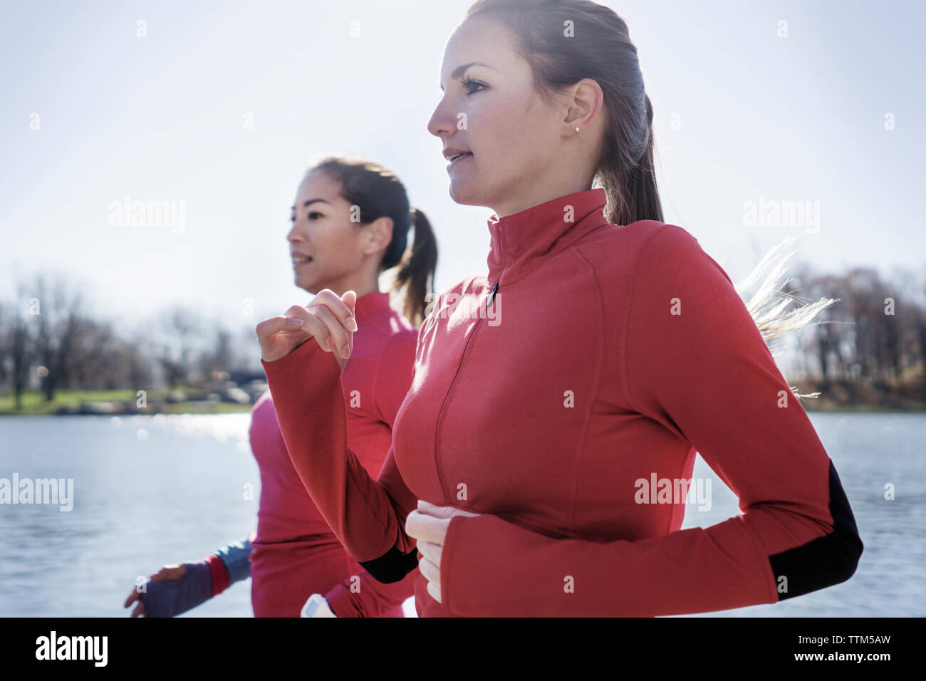 Women running together hi-res stock photography and images - Alamy