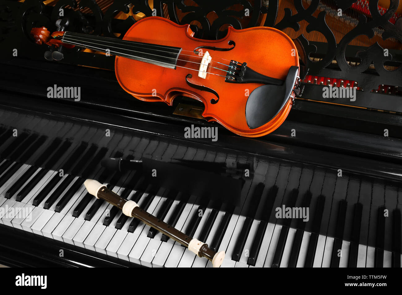 Flute and violin on piano Stock Photo - Alamy