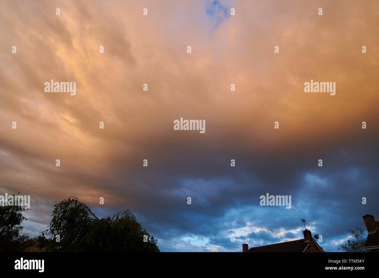 Evening skylight as the sun shines on rain clouds after a rainy day ...