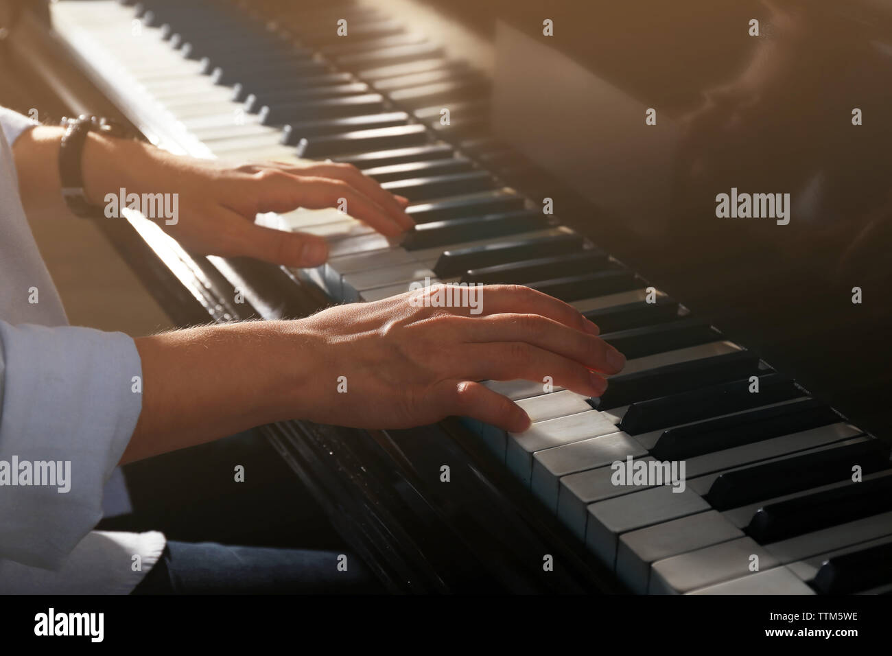 Female hands playing piano Stock Photo - Alamy