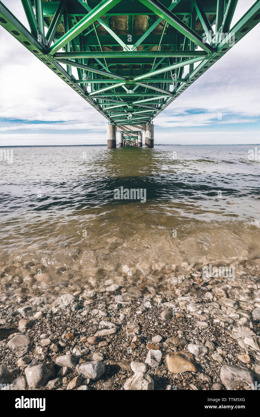 Low angle view of bridge over sea Stock Photo - Alamy