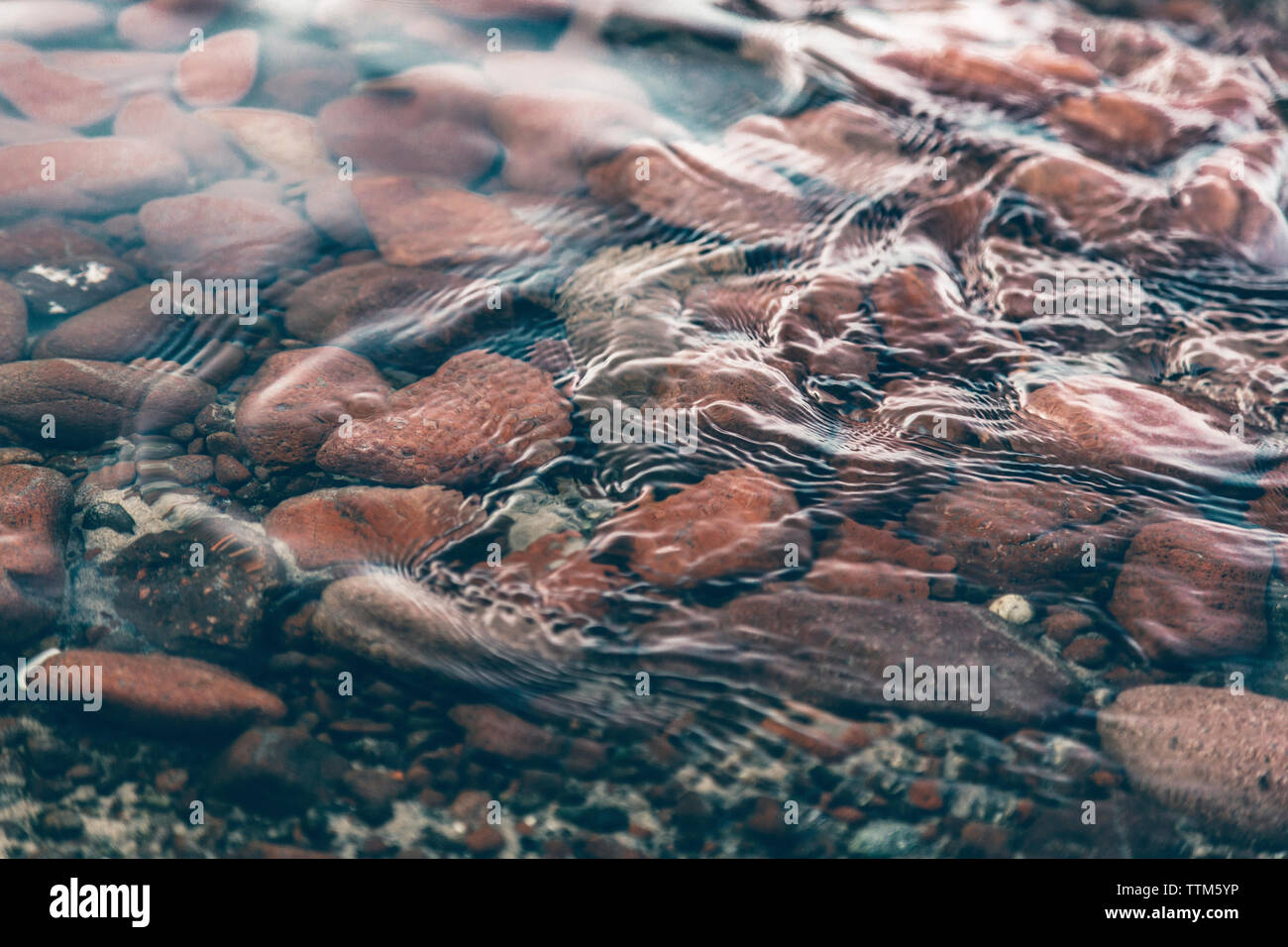 Blurred pebbles in water hi-res stock photography and images - Alamy