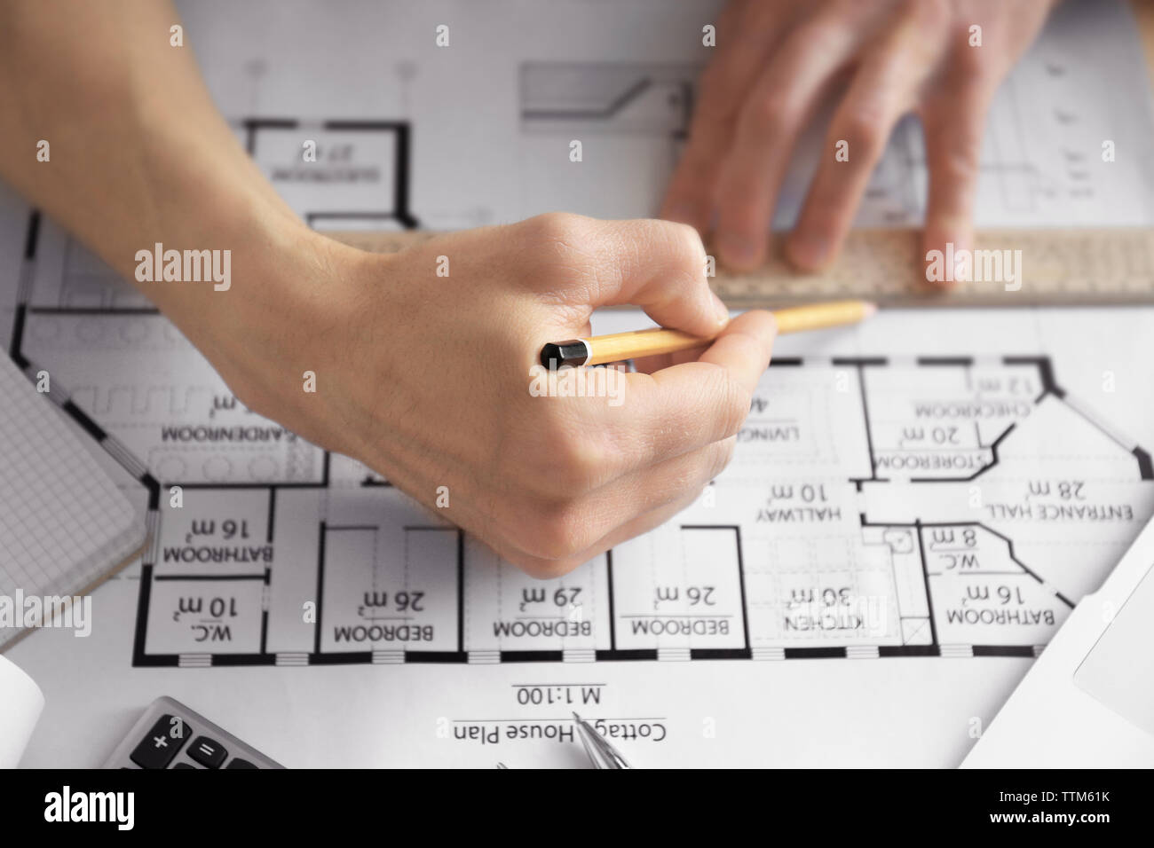 Man working with engineer blueprints Stock Photo - Alamy