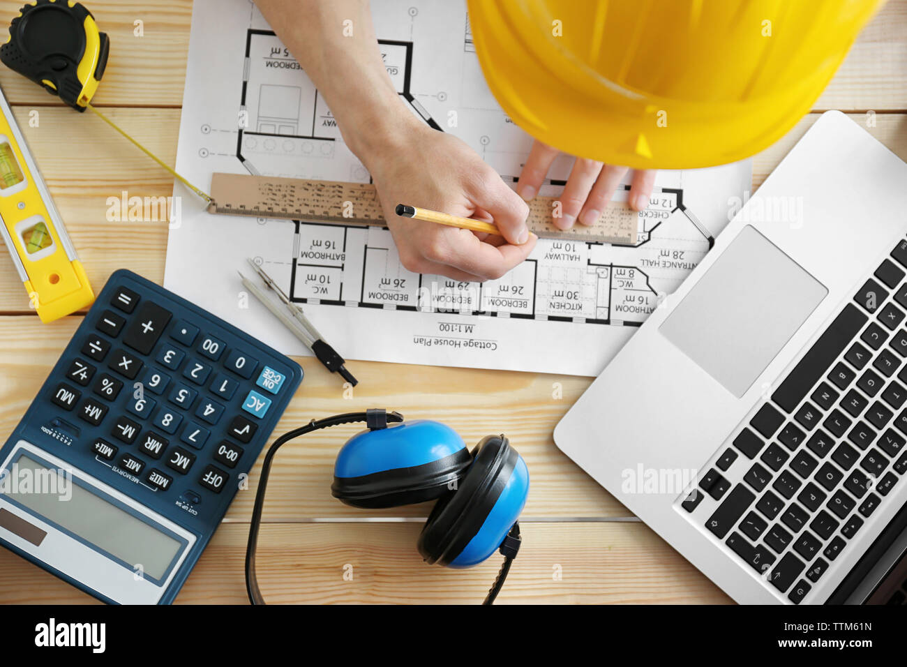 Man working with engineer blueprints Stock Photo - Alamy
