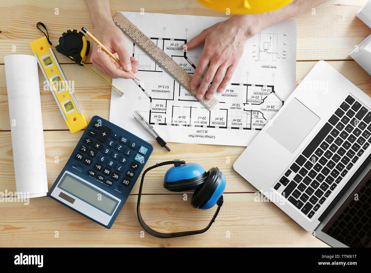 Engineer man working blueprints calculator hi-res stock photography and ...