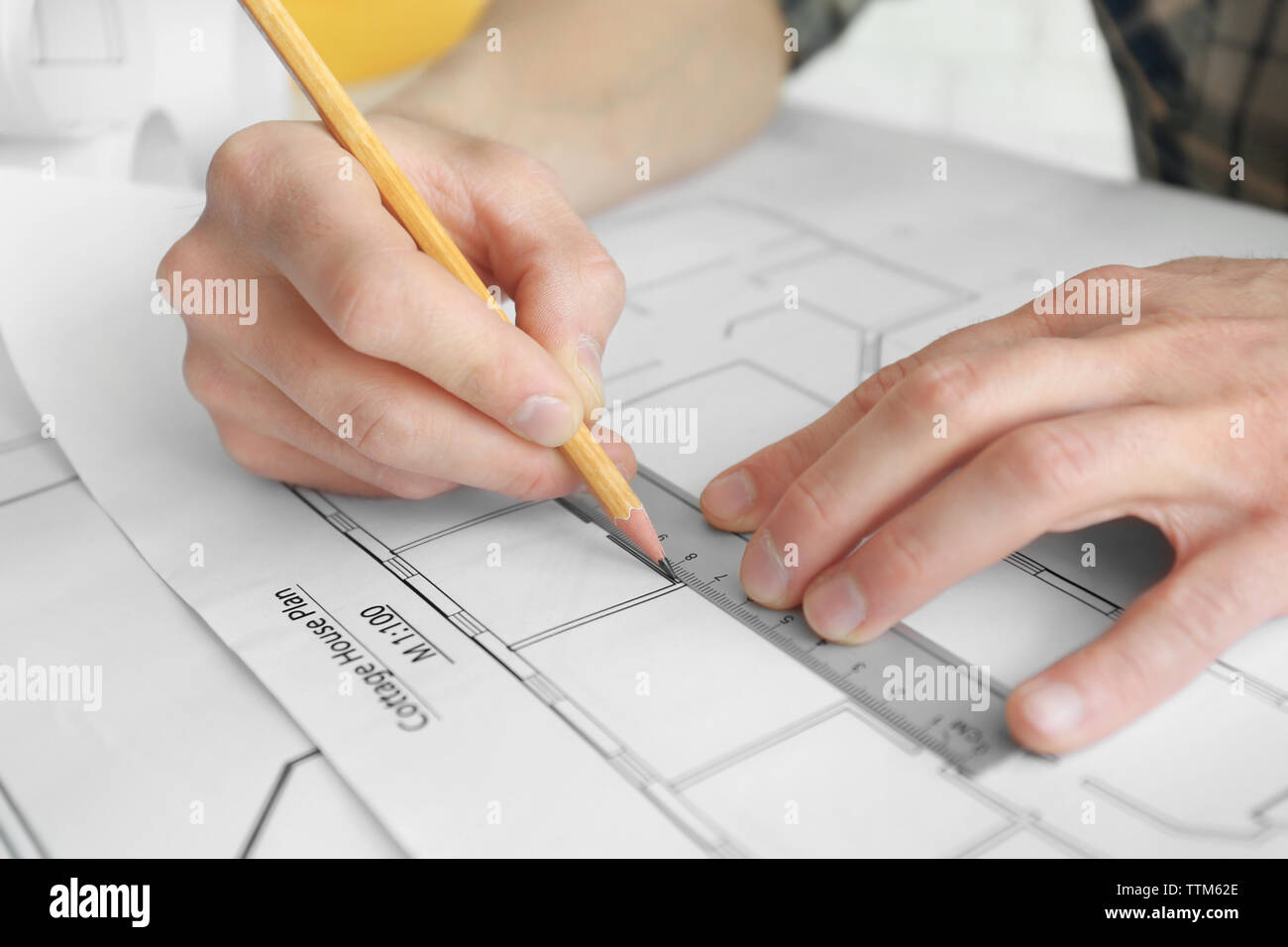 Man working with engineer blueprints Stock Photo - Alamy