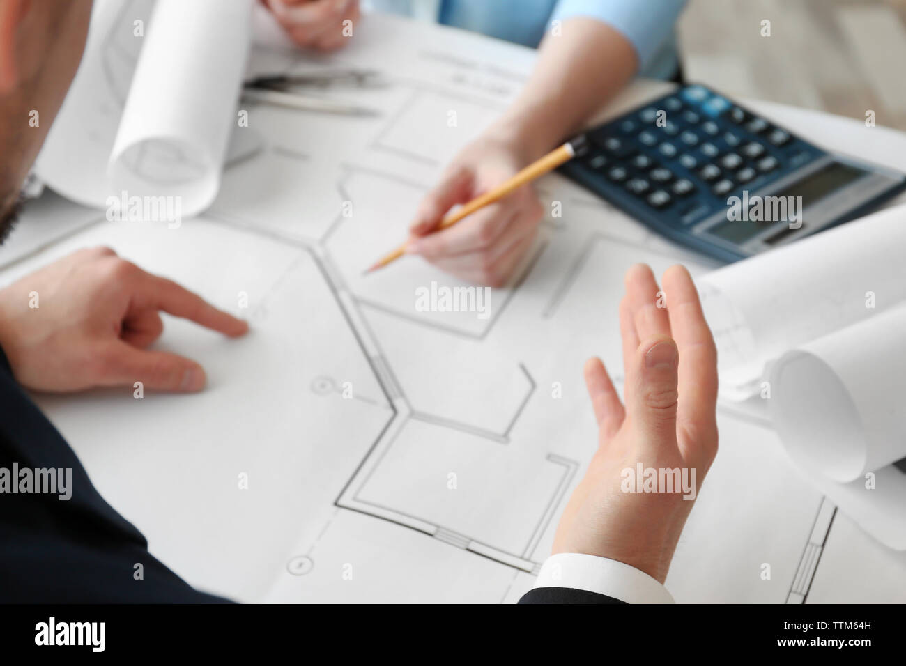 Engineers working with blueprints Stock Photo - Alamy