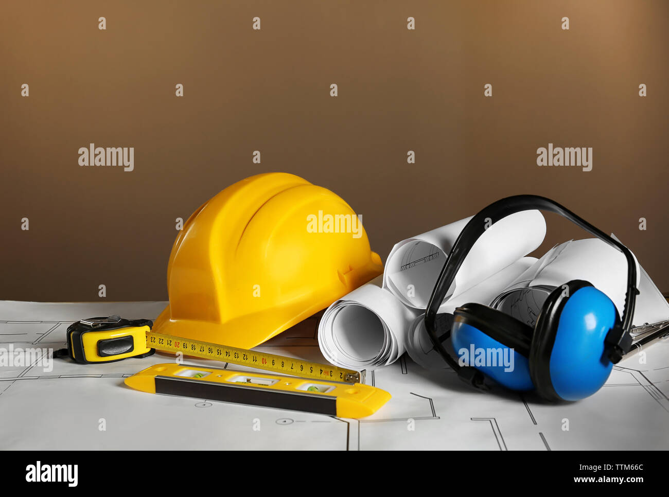 Construction plans and builder equipment on table Stock Photo - Alamy