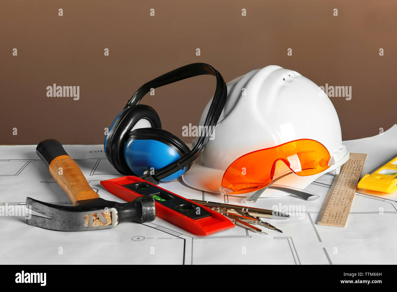 Construction plans and builder equipment on table Stock Photo - Alamy