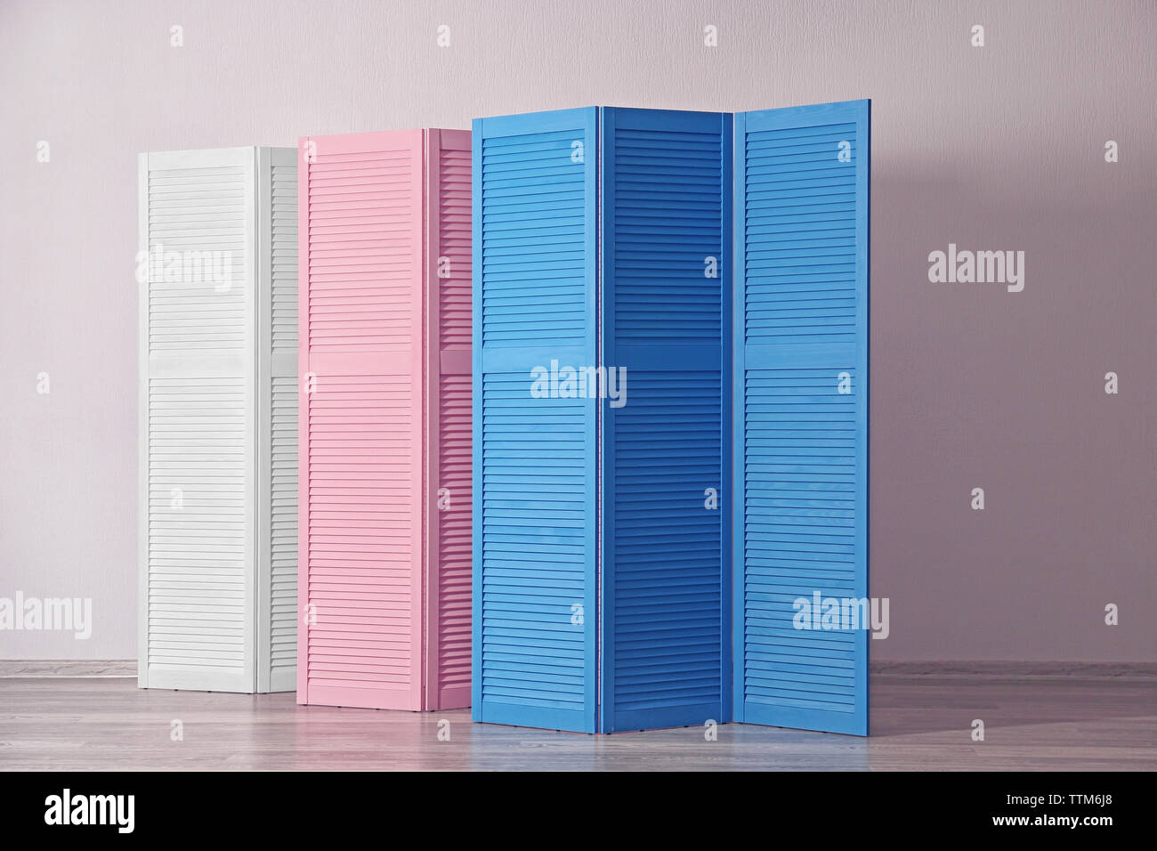 Color folding screens in room Stock Photo - Alamy